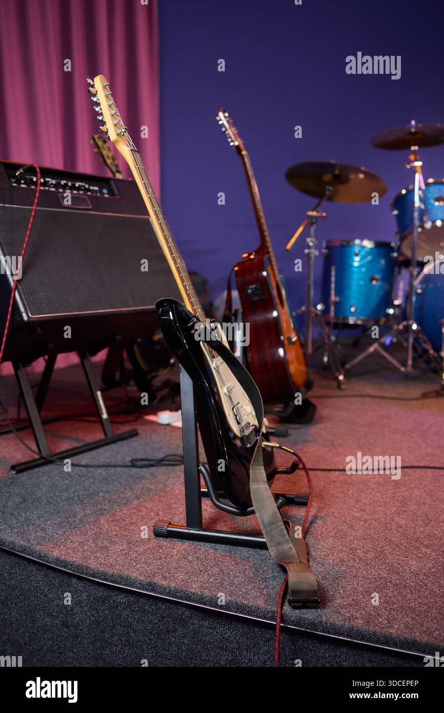 A vibrant and dynamic music studio space that showcases a bass guitar ...