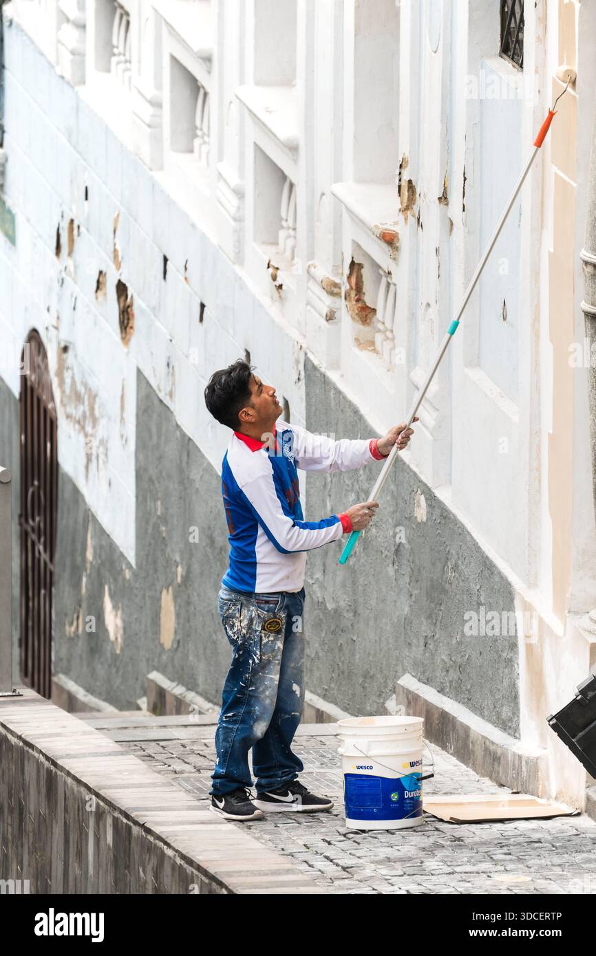 Quito, Ecuador - 17 October 2025: View of a painter meticulously ...