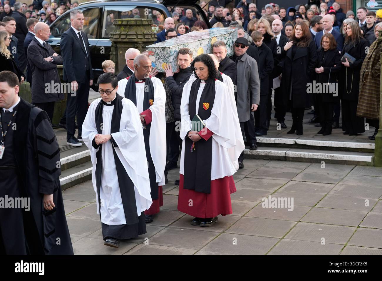 The bearer party carry the coffin decorated in the iconic artwork 'Bye ...