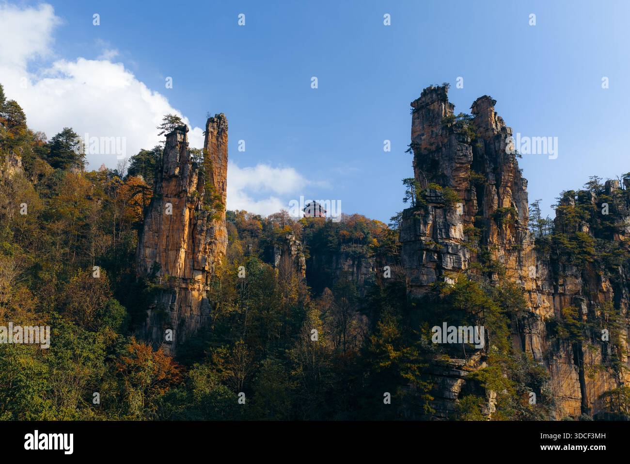 Aerial view of towering sandstone pillars piercing the sky, a symphony ...