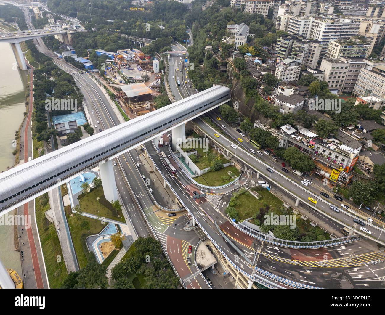 Aerial view of a vibrant highway interchange cutting through the city's ...