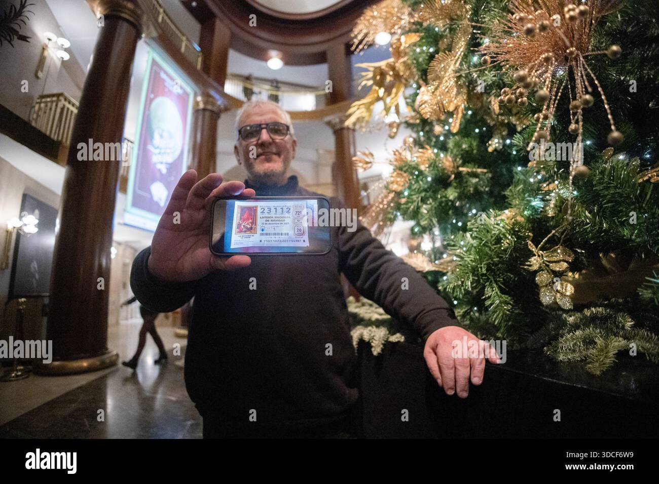A winner of a Fifth Prize poses for Europa Press during the celebration ...