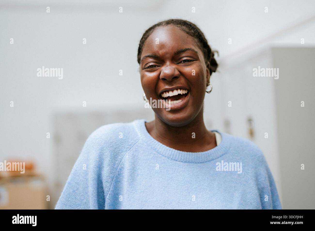 Person wearing blue sweater hi-res stock photography and images - Alamy