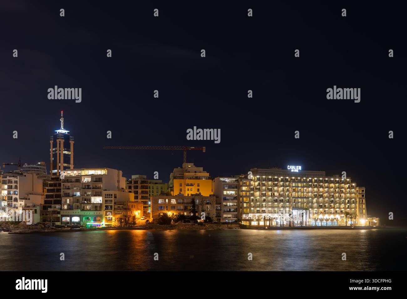 The Cavalieri Art Hotel at night in St. Julian town in Malta Stock ...