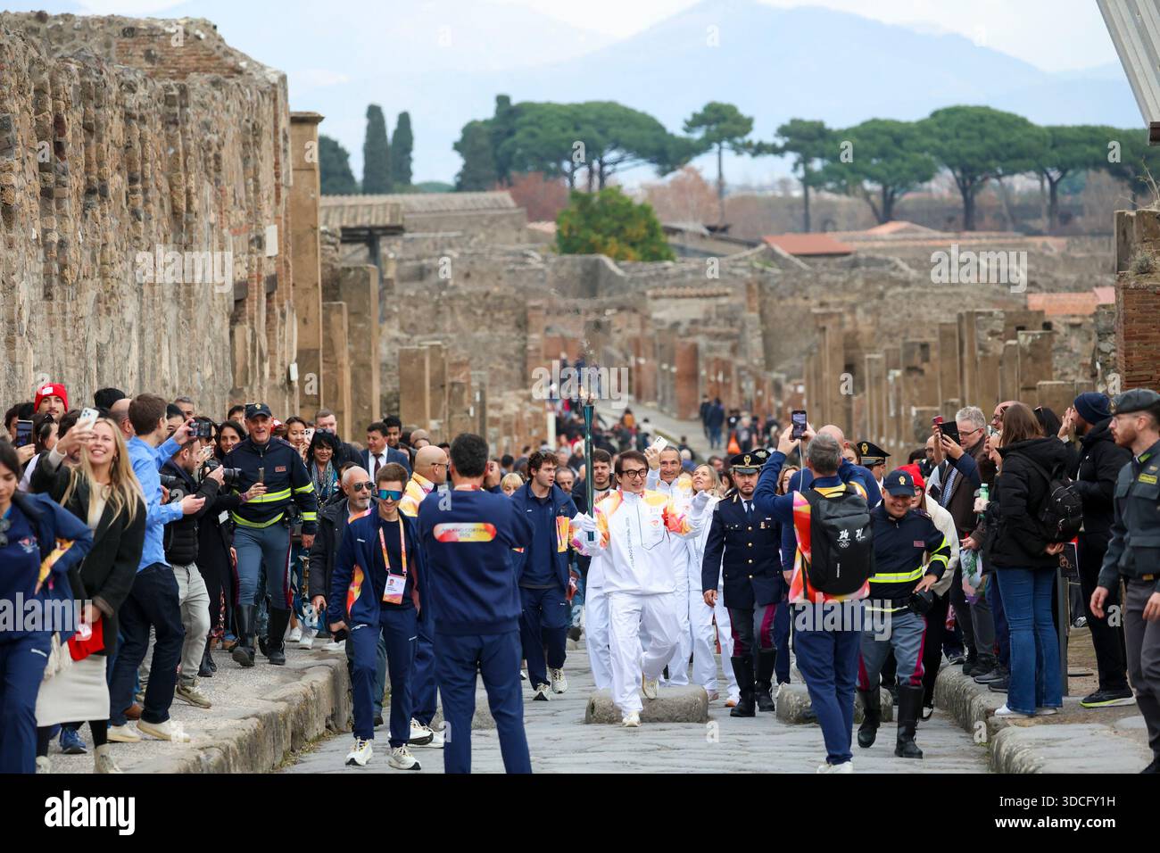 Actor Jackie Chan holds the olympic torch passing through the ...