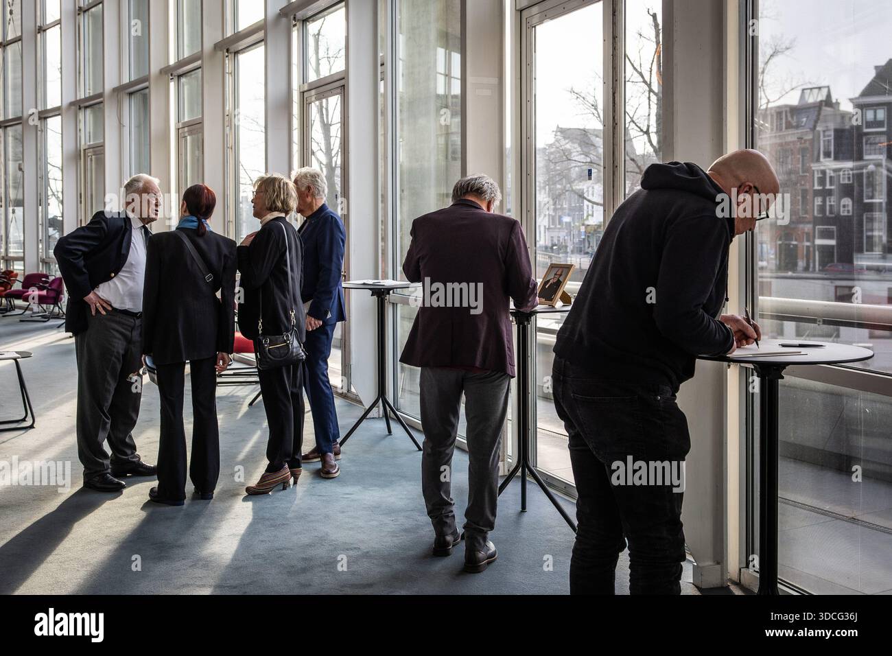 AMSTERDAM – Visitors sign the condolence book at the farewell of Hans ...