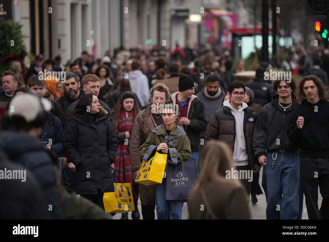 Shoppers walk along London's most famous shopping Street, Oxford Street ...
