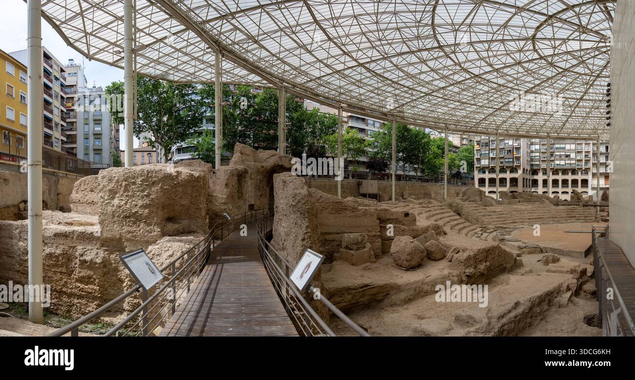 An archaeological site with ancient ruins covered by a modern glass ...