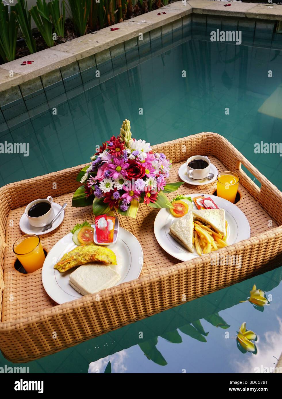 Set of floating breakfast tray in swimming pool. Breakfast in swimming ...