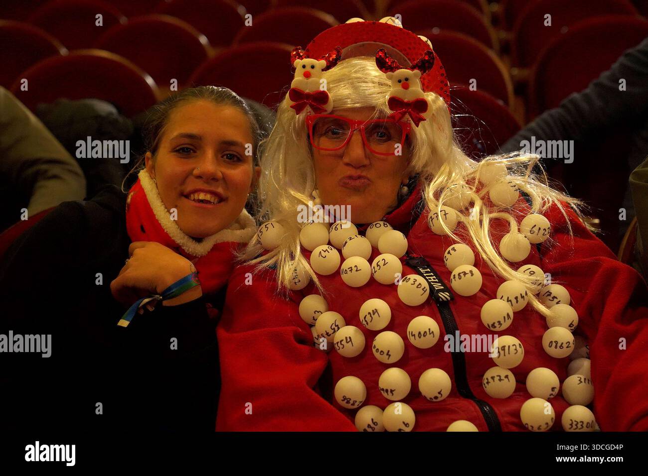 Several people in costume wait for the start of the Sorteo ...