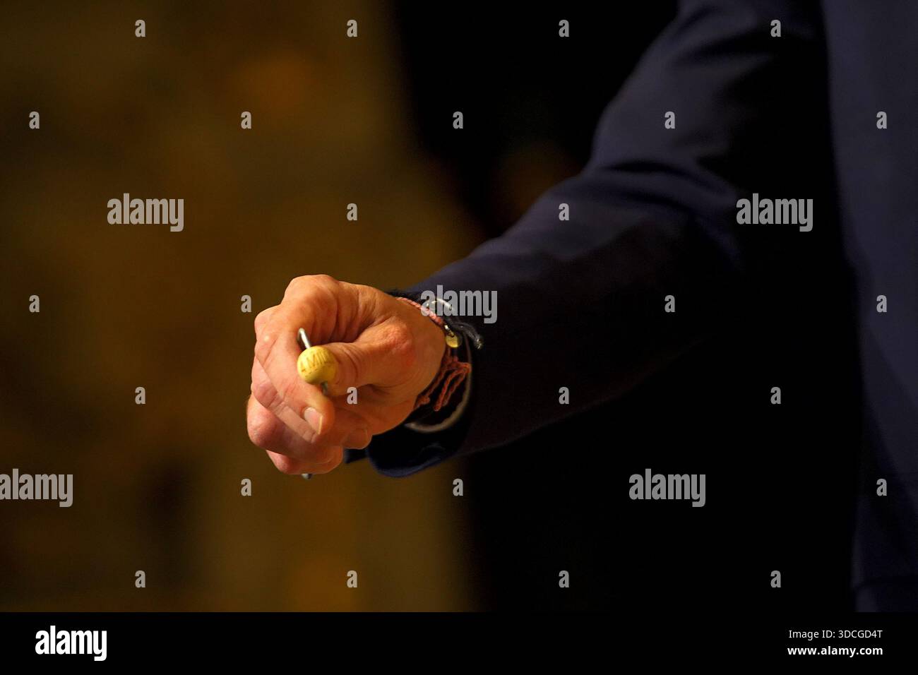 A man puts the balls with the prizes into the lottery drum during the ...
