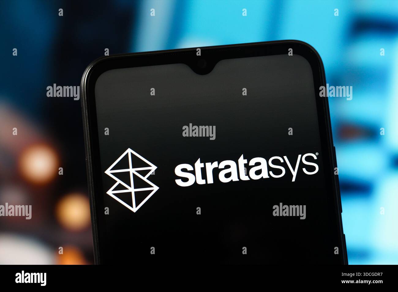 In this photo illustration, the Stratasys logo is seen displayed on a ...