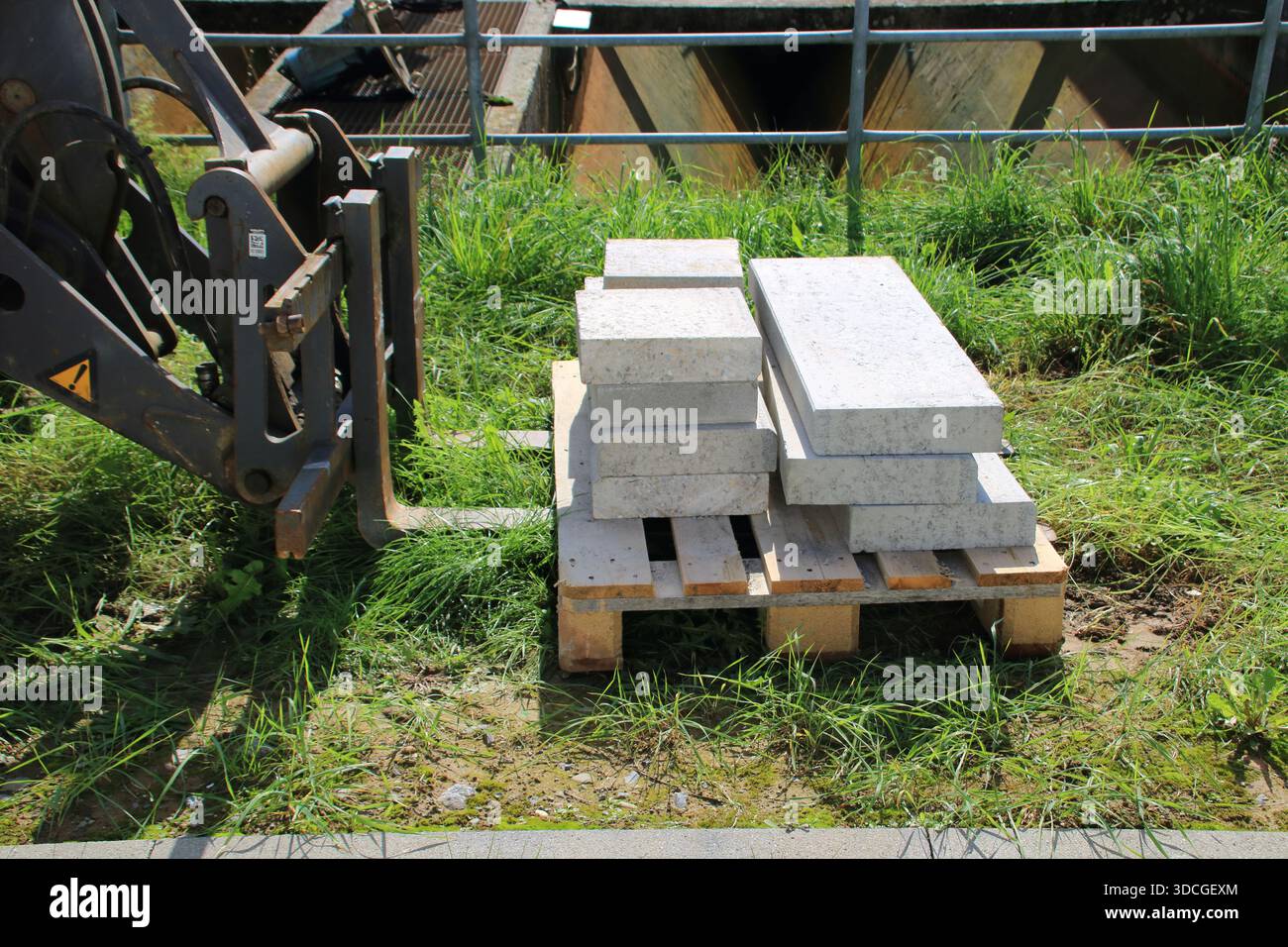 Concrete slabs on a pallet are transported with a wheel loader Stock ...