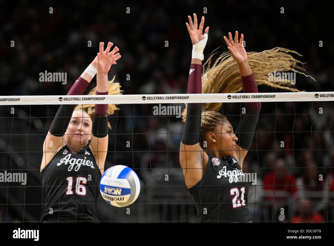 Texas A&M setter Maddie Waak (16) and Texas A&M middle blocker Morgan ...