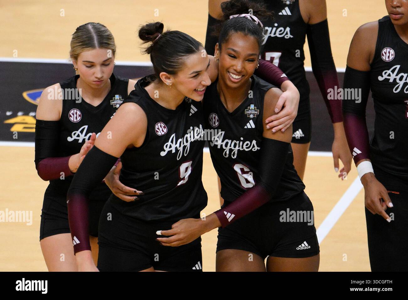 Texas A&M opposite Logan Lednicky (9) hugs Texas A&M opposite Taryn ...