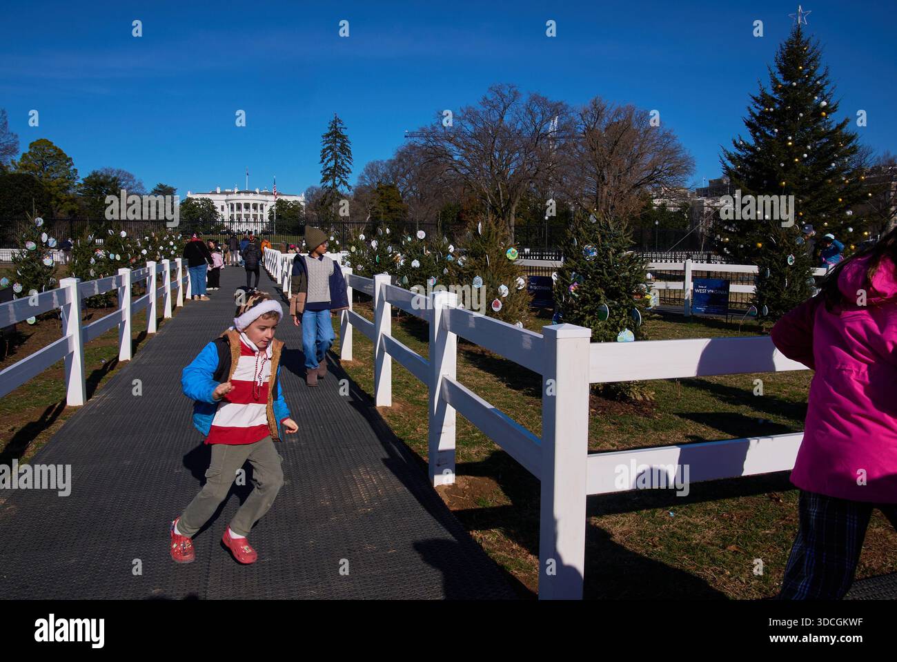 Benjamin, 7, whose parents are veterans, wears a camouflage Santa hat ...