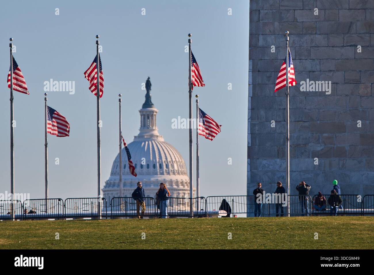 People visit the Washington Monument, with the Capitol in the ...