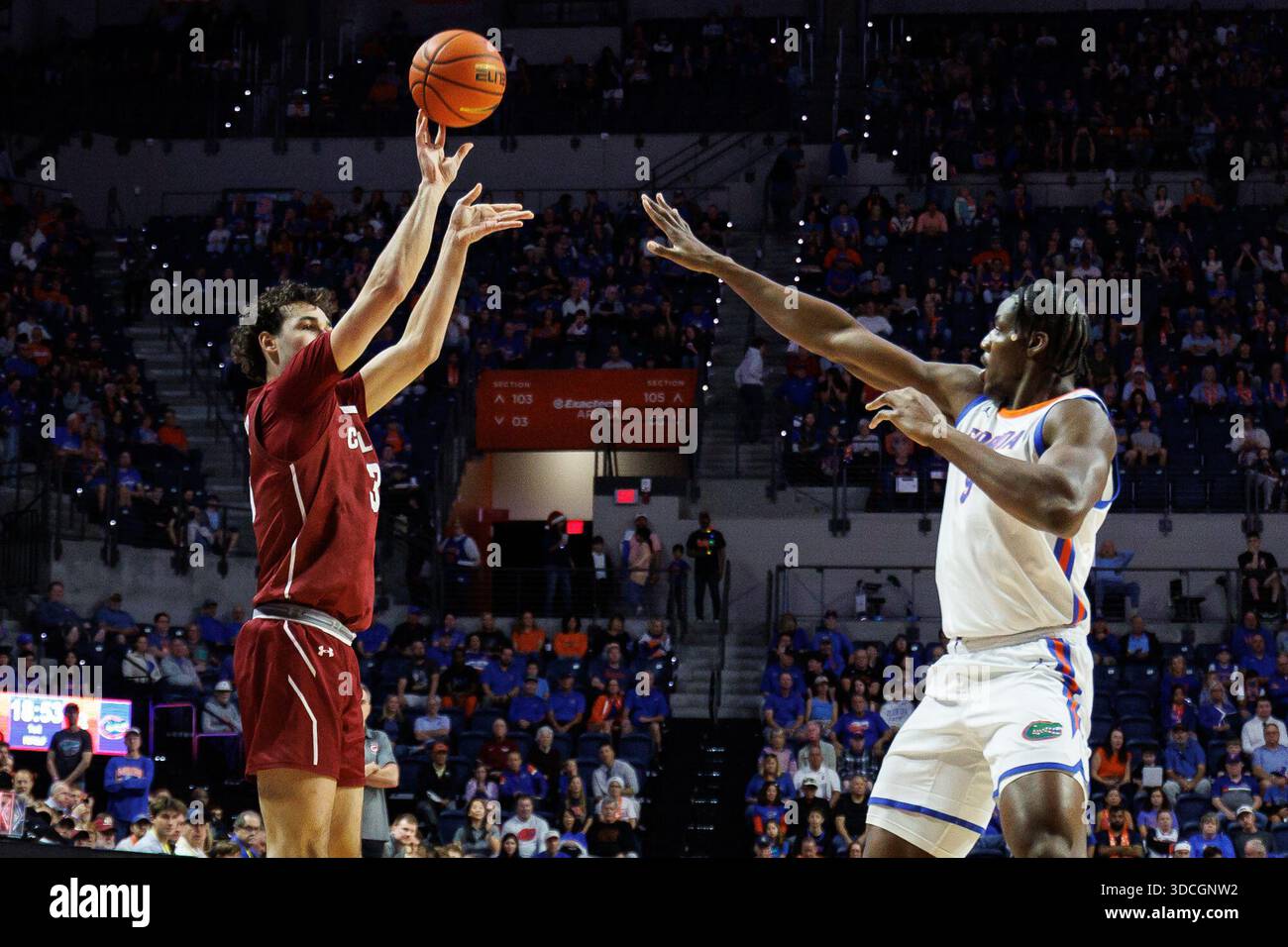 Florida center Rueben Chinyelu (9) defends a shot by Colgate forward ...