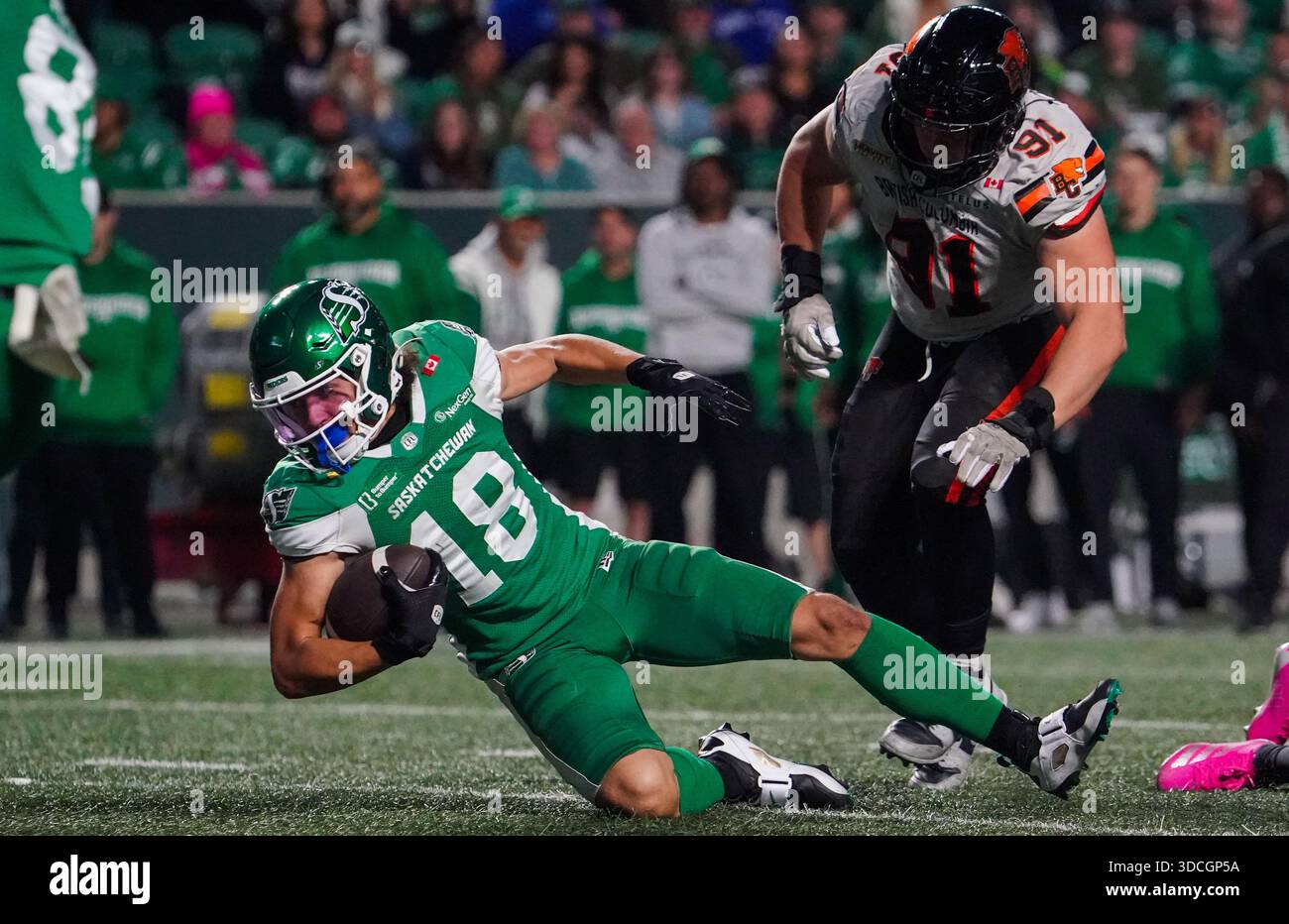 Saskatchewan Roughriders receiver Dhel Duncan-Busby (18) falls as B.C ...