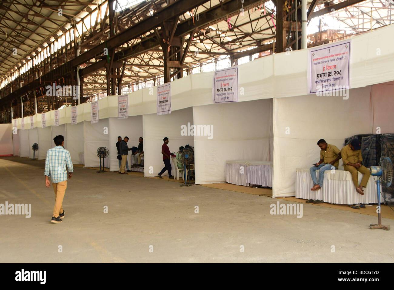MUMBAI, INDIA - DECEMBER 22: Workers prepare election booth tents at ...