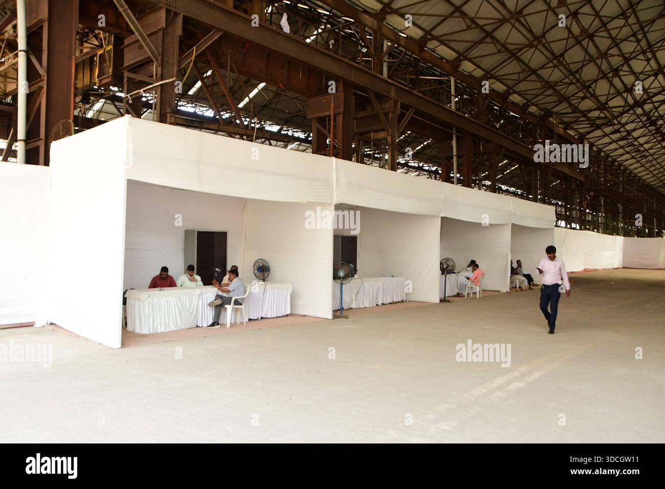 MUMBAI, INDIA - DECEMBER 22: Workers prepare election booth tents at ...