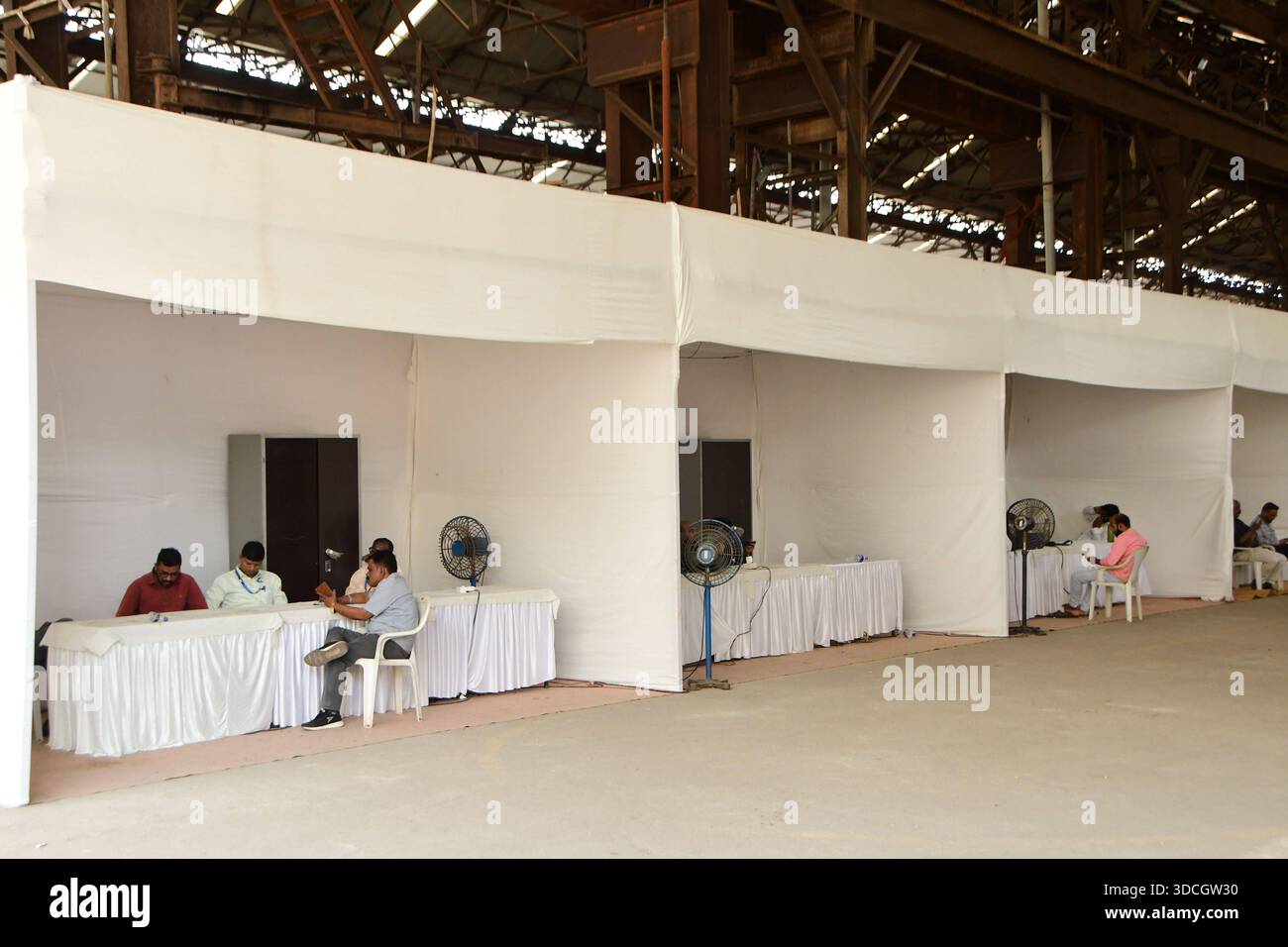 MUMBAI, INDIA - DECEMBER 22: Workers prepare election booth tents at ...