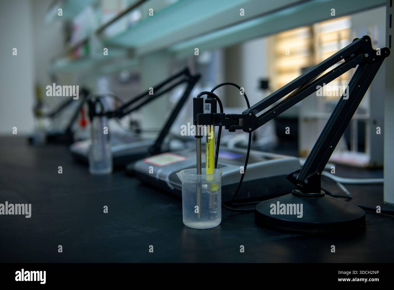 Laboratory equipment with pH meters on a workbench Stock Photo - Alamy