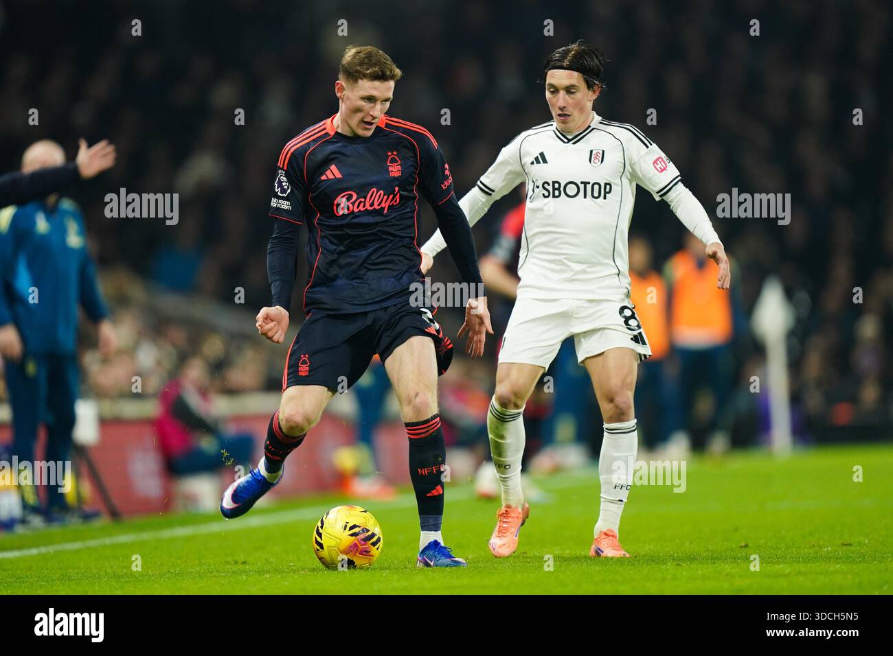 Elliot Anderson of Nottingham Forest under pressure from Harry Wilson ...