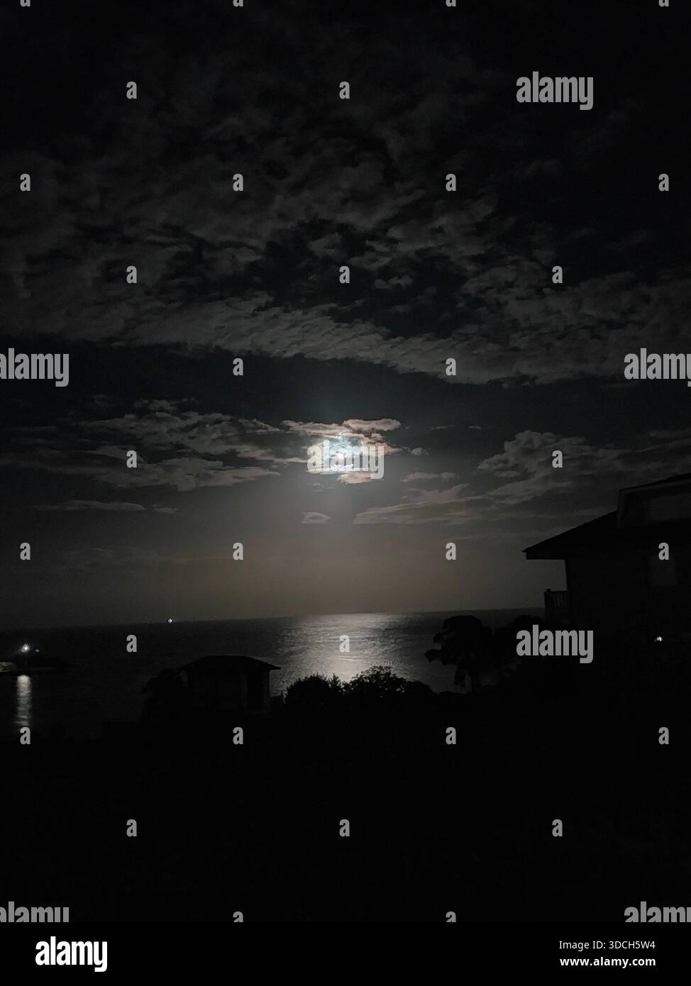 full moon reflected on the Cantabrian sea in Burela, Spain Stock Photo ...