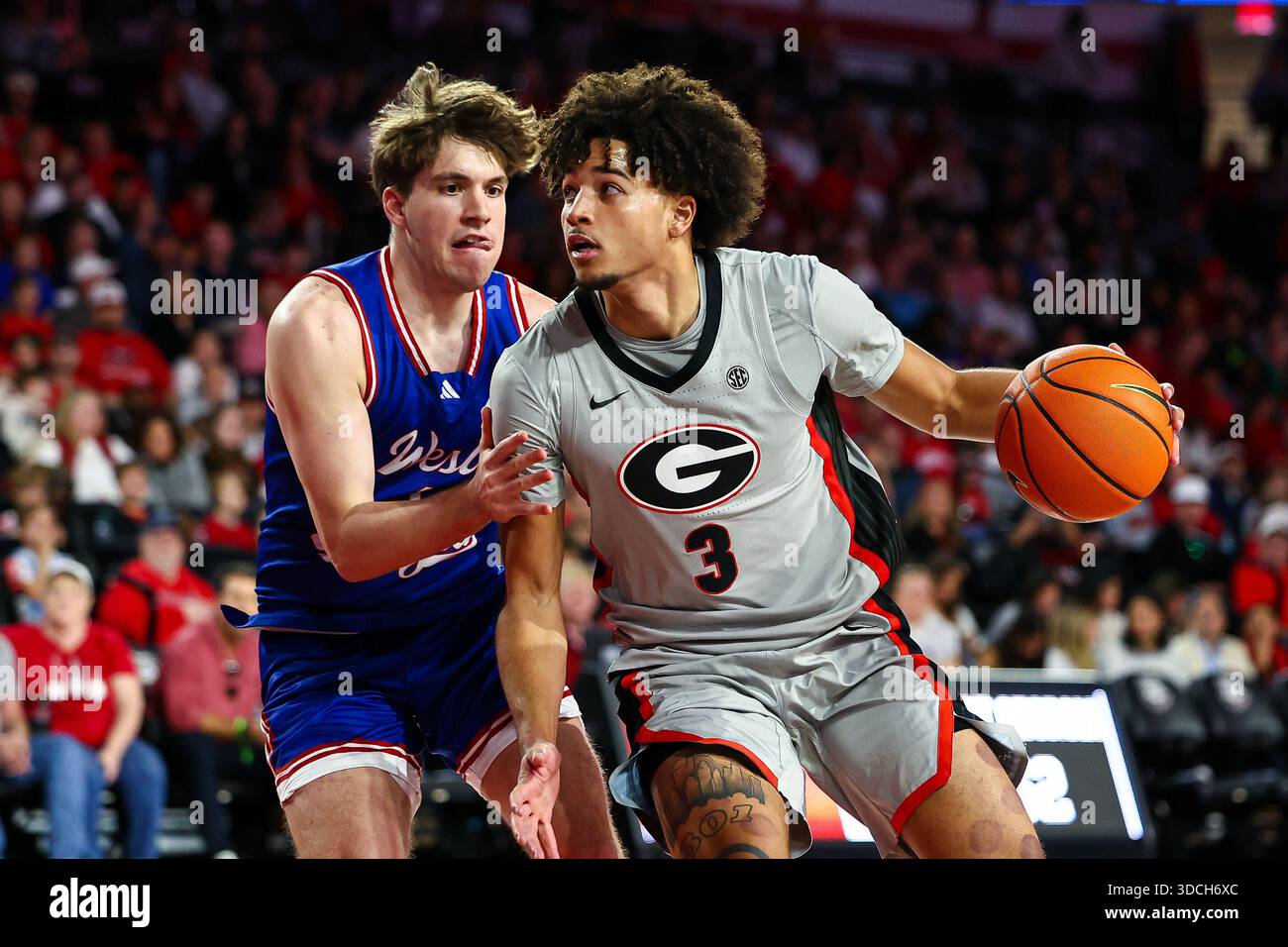 West Georgia guard Brady Hardewig, left, guards Georgia guard Jordan ...