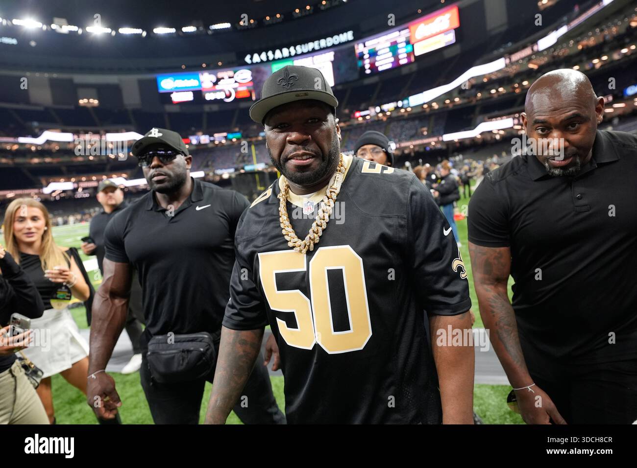 Rapper 50 Cent poses with fans before an NFL football game between the ...