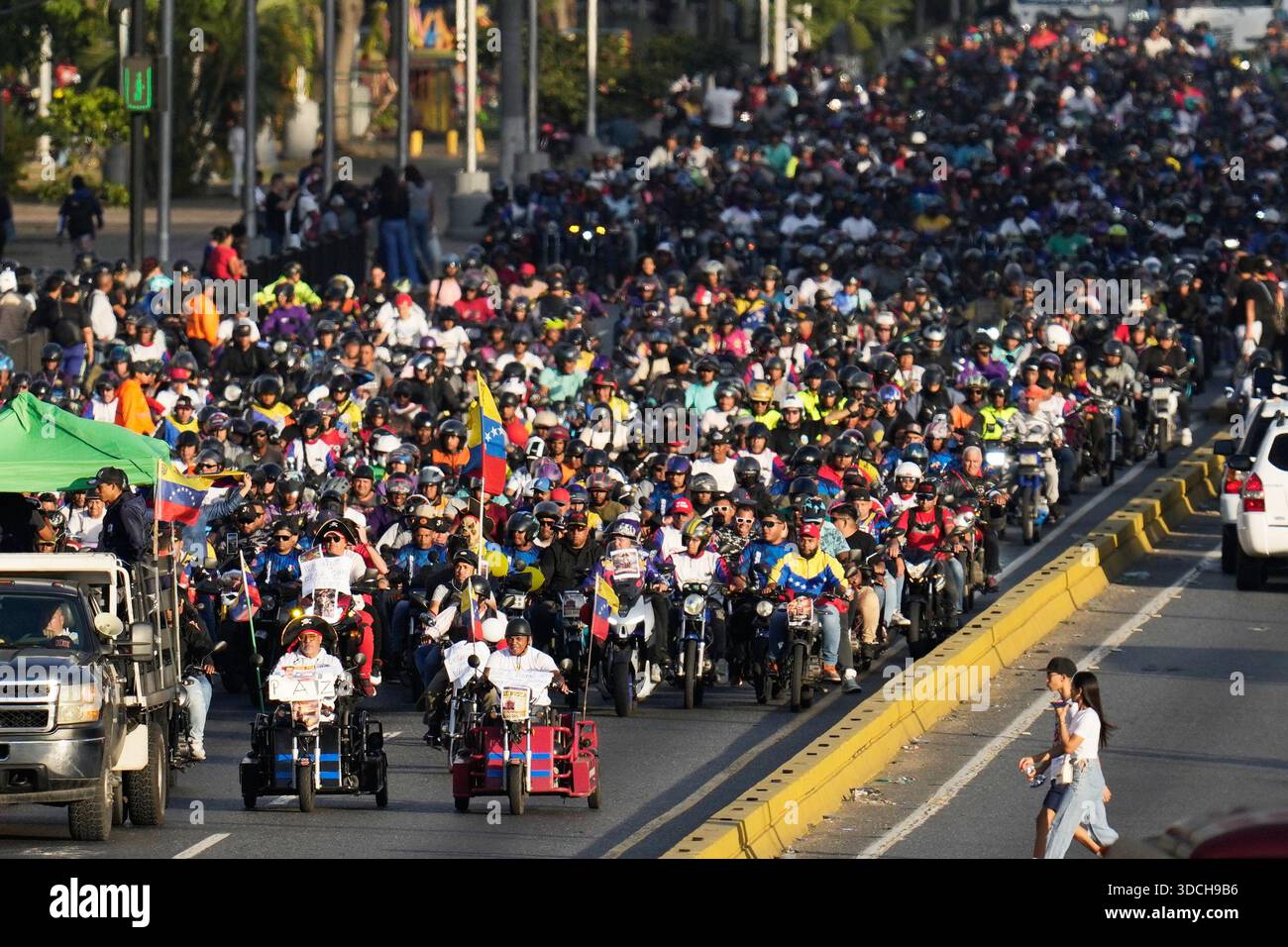 Government supporters ride motorbikes through Caracas, Venezuela ...
