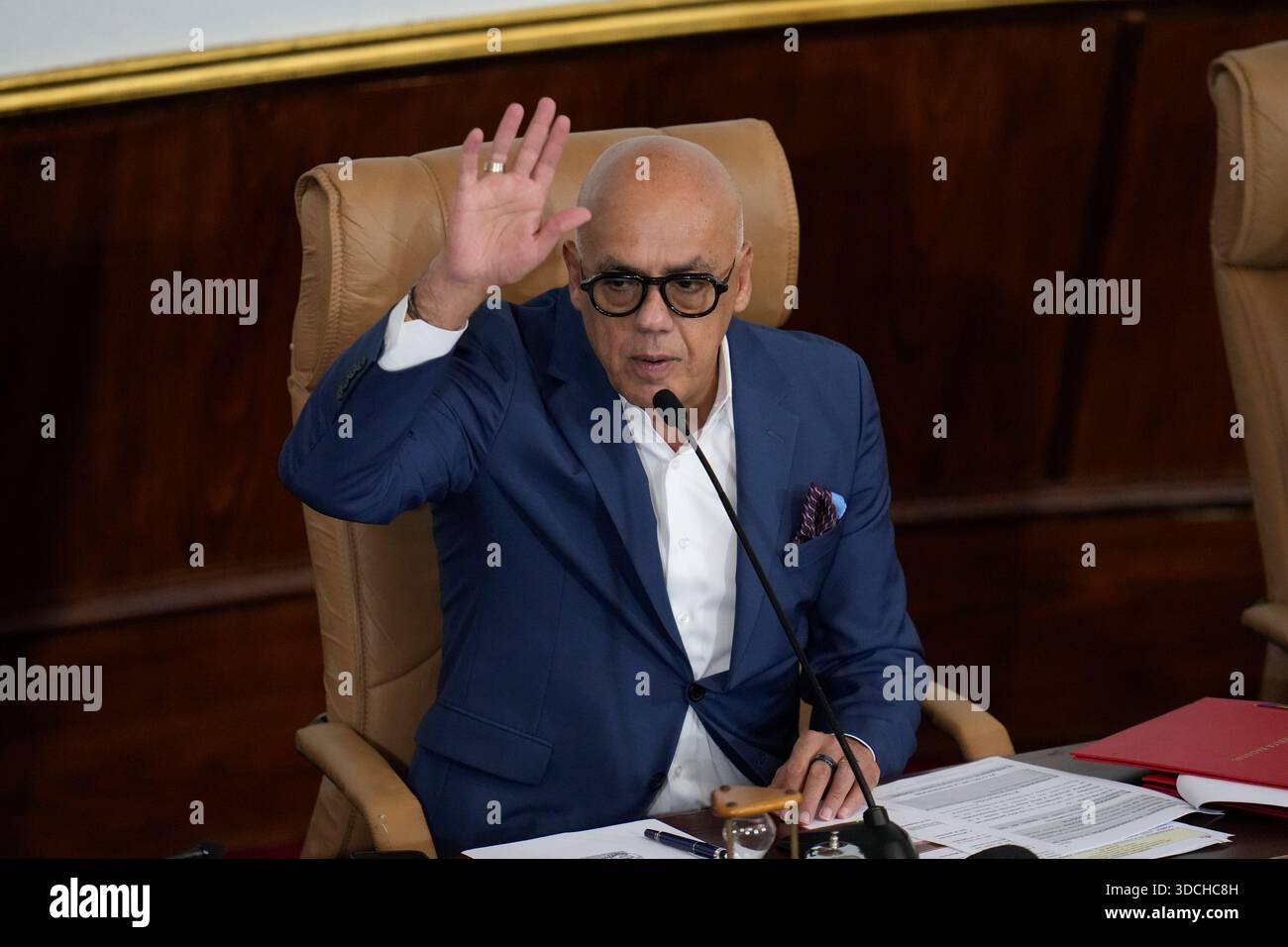 National Assembly President Jorge Rodriguez raises his hand during an ...