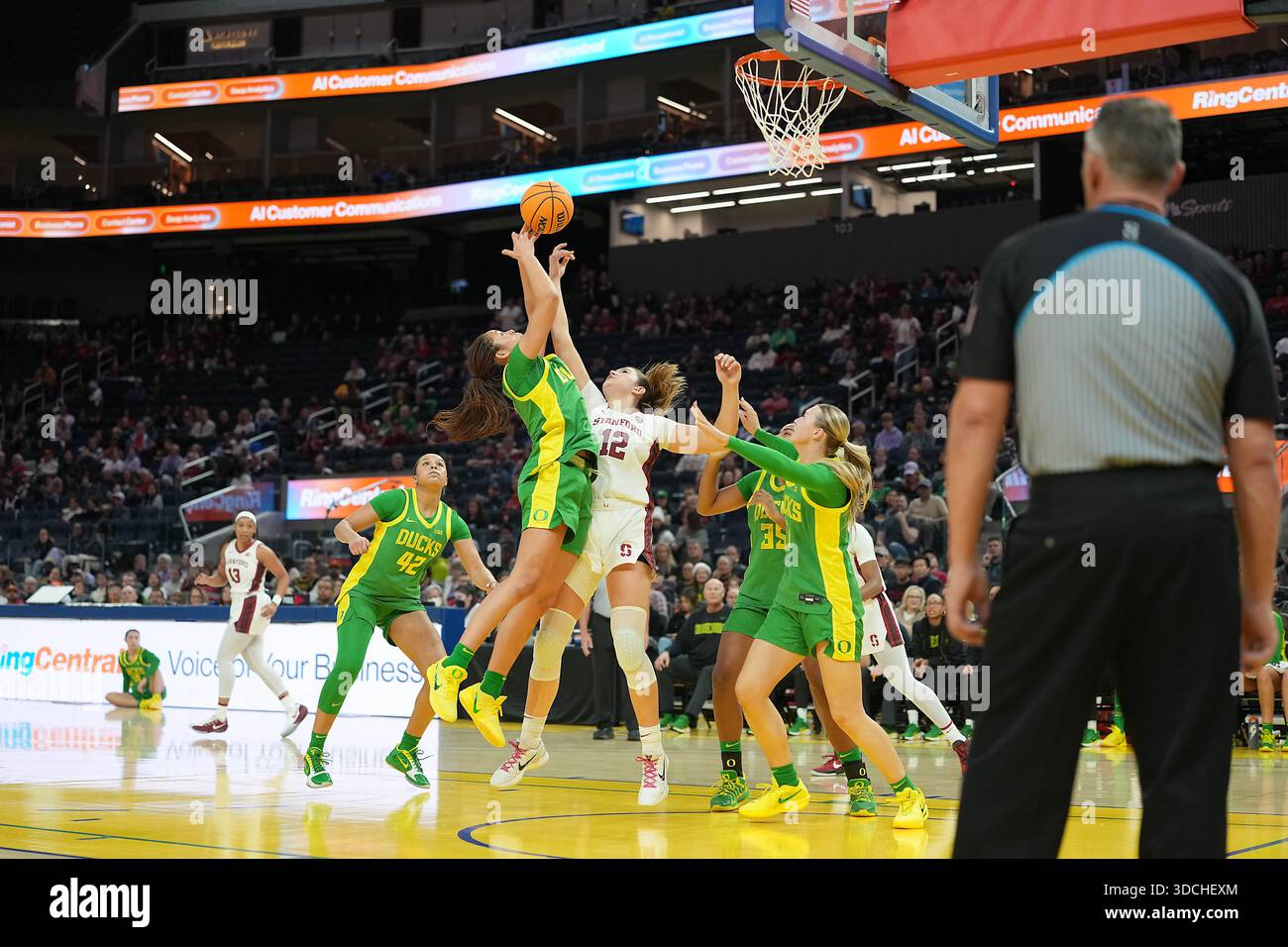 Sofia Bell (3) of the Oregon Ducks and Lara Somfai (12) of the Stanford ...