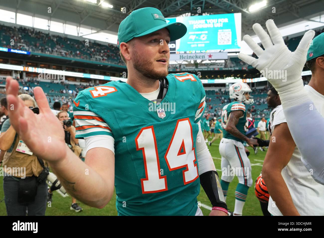 Miami Dolphins quarterback Quinn Ewers (14) greets a Cincinnati Bengals ...
