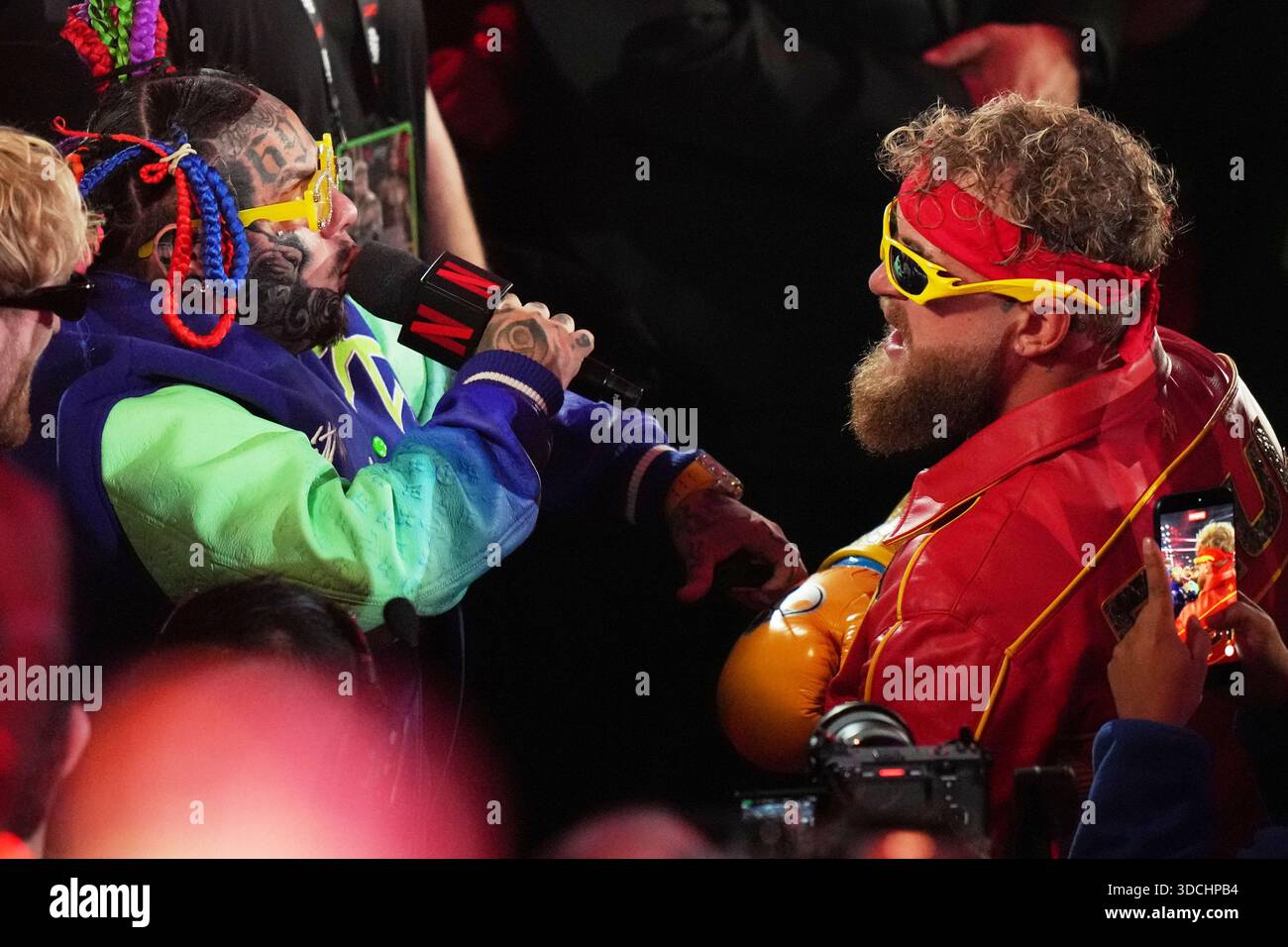 Jake Paul, right, arrives for a heavyweight boxing match against ...