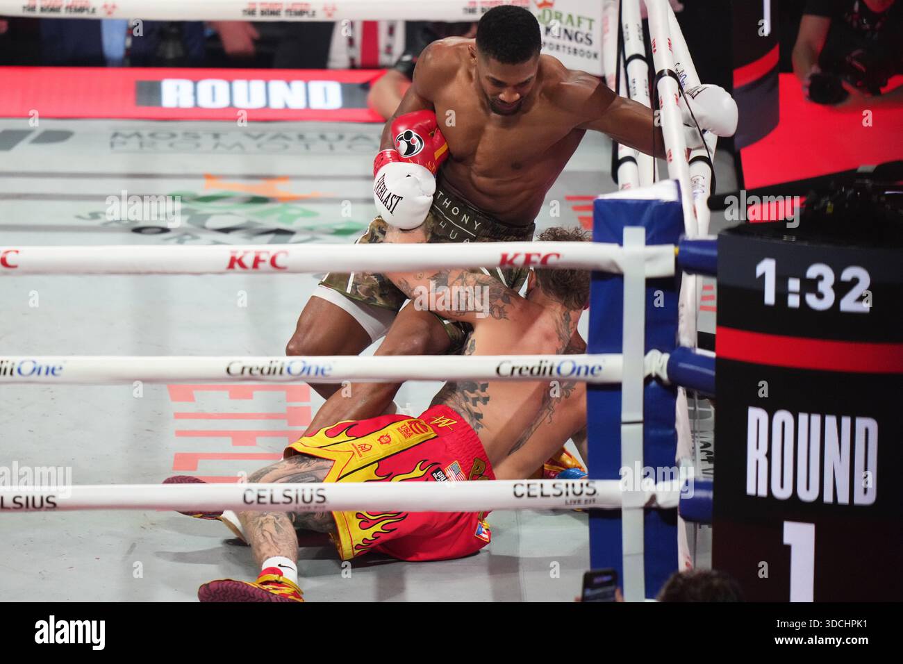 Anthony Joshua, top, and Jake Paul, bottom, compete during their ...