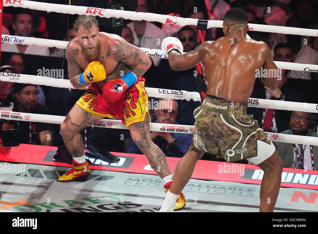 Jake Paul, left, and Anthony Joshua, right, compete during their ...