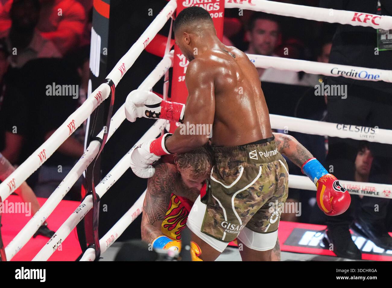 Jake Paul, left, and Anthony Joshua, right, compete during their ...