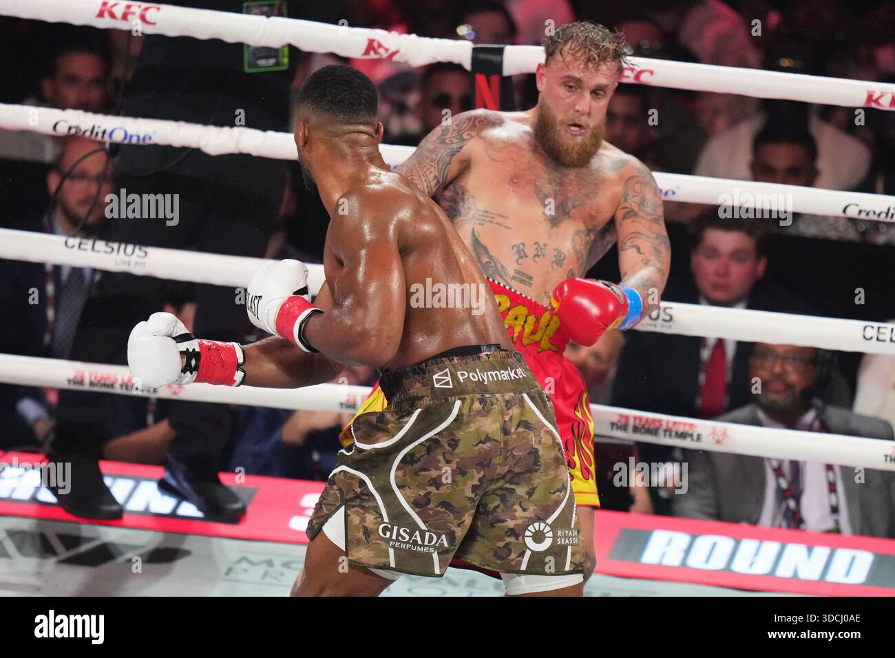Anthony Joshua, left, and Jake Paul, right, compete during their ...