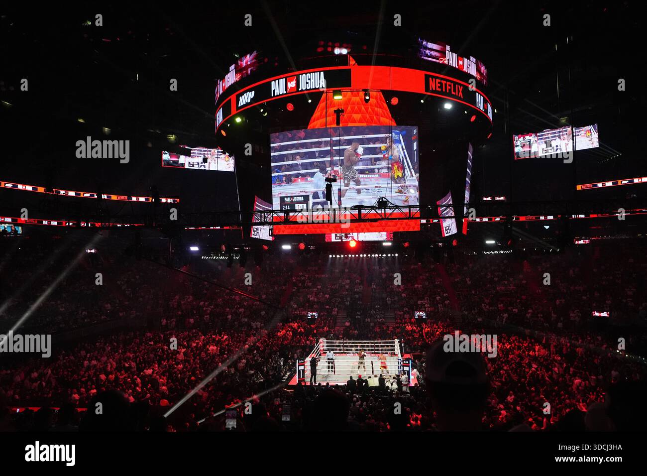 Jake Paul, right, and Anthony Joshua, left, compete during their ...