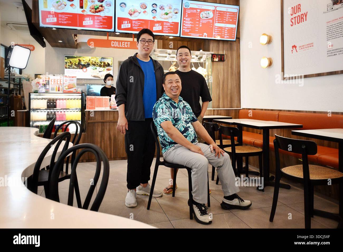 Fong Chi Chung (seated), the founder, owner, and CEO of the Putien ...