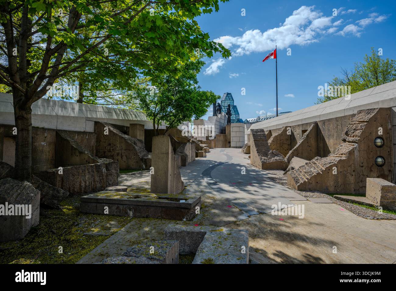 Concrete forms frame the Military Reconciliation Monument, with statues ...
