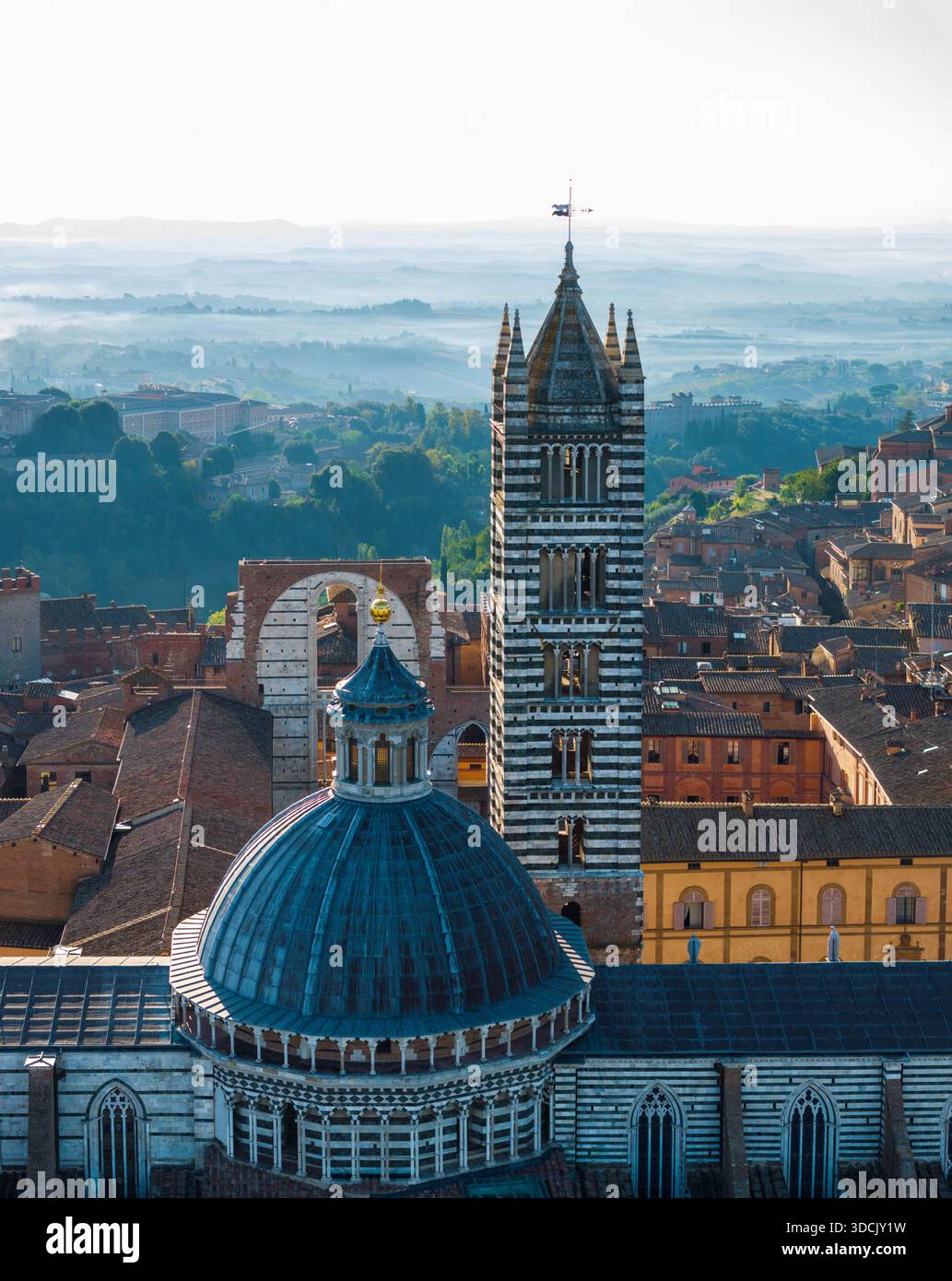 Aerial view of the Duomo's dome and Torre del Mangia pierce the skyline ...