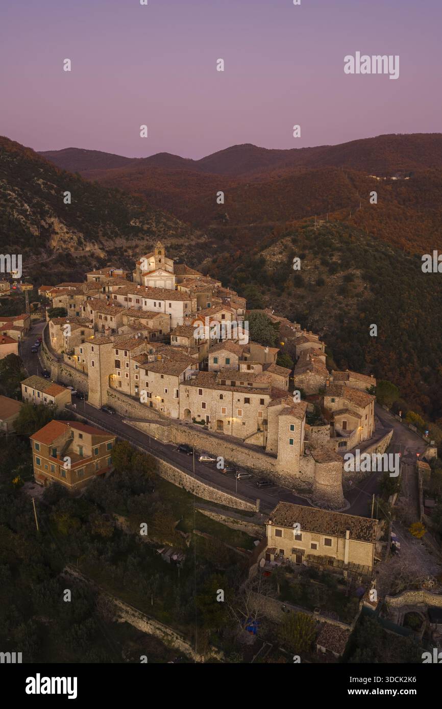 Aerial view of ancient stone buildings bathed in the fading light ...