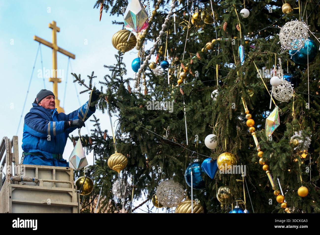 A worker decorates Russia's Main Christmas tree at the Cathedral Square ...