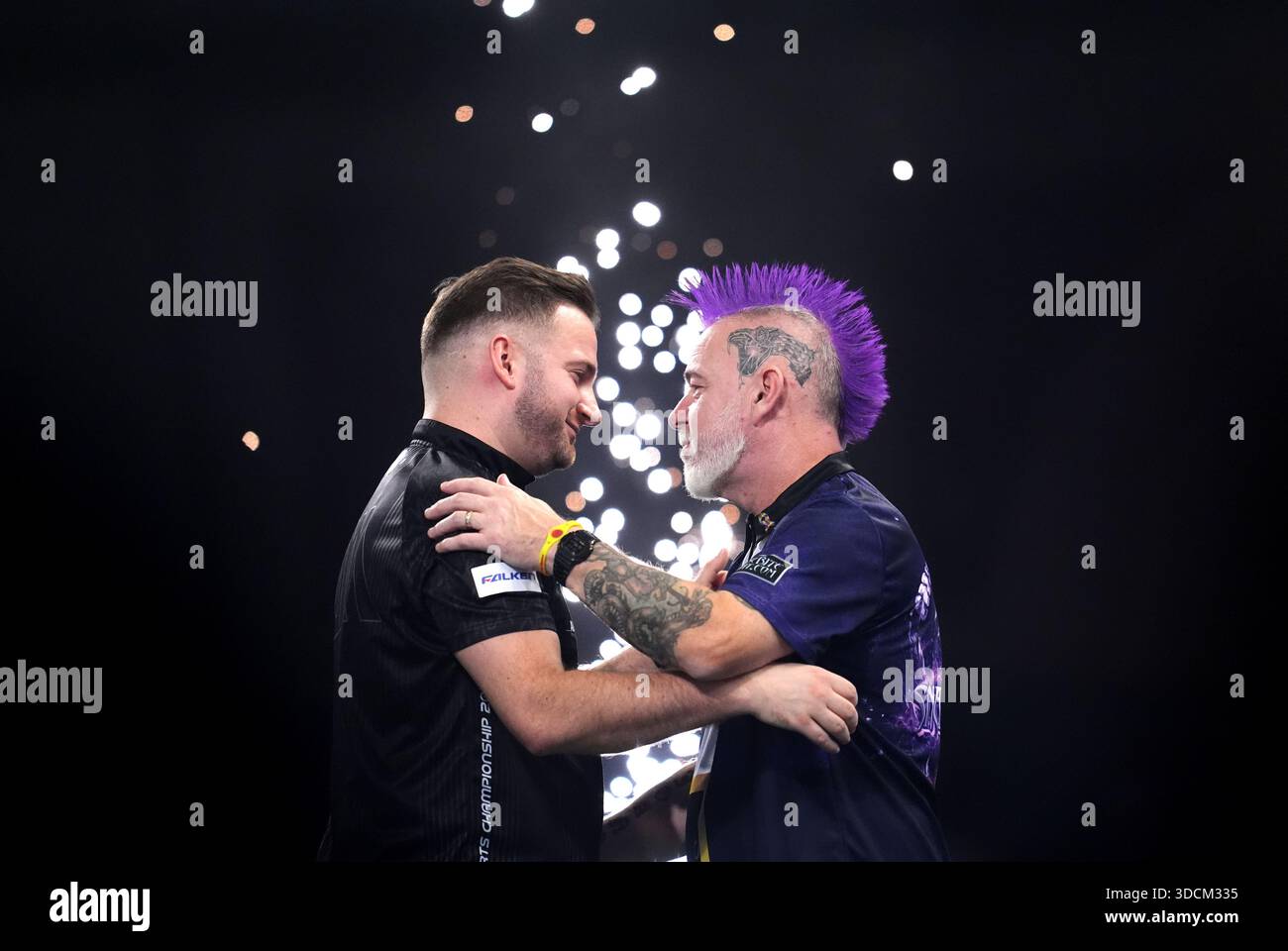 Germany's Arno Merk (left) celebrates defeating Scotland's Peter Wright ...
