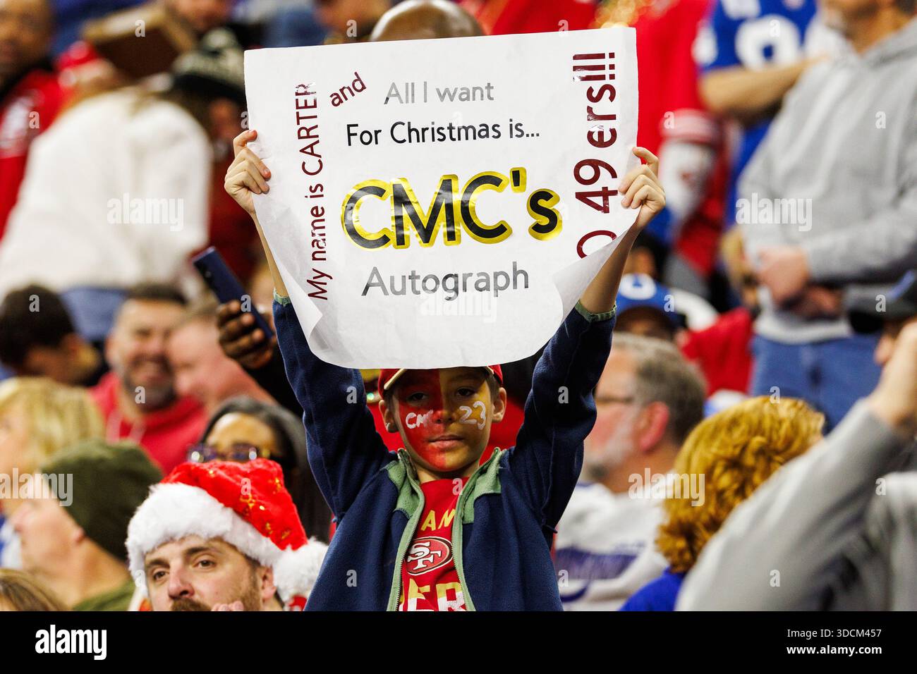 December 22, 2025: A young San Francisco 49ers fan holds Christmas wish ...