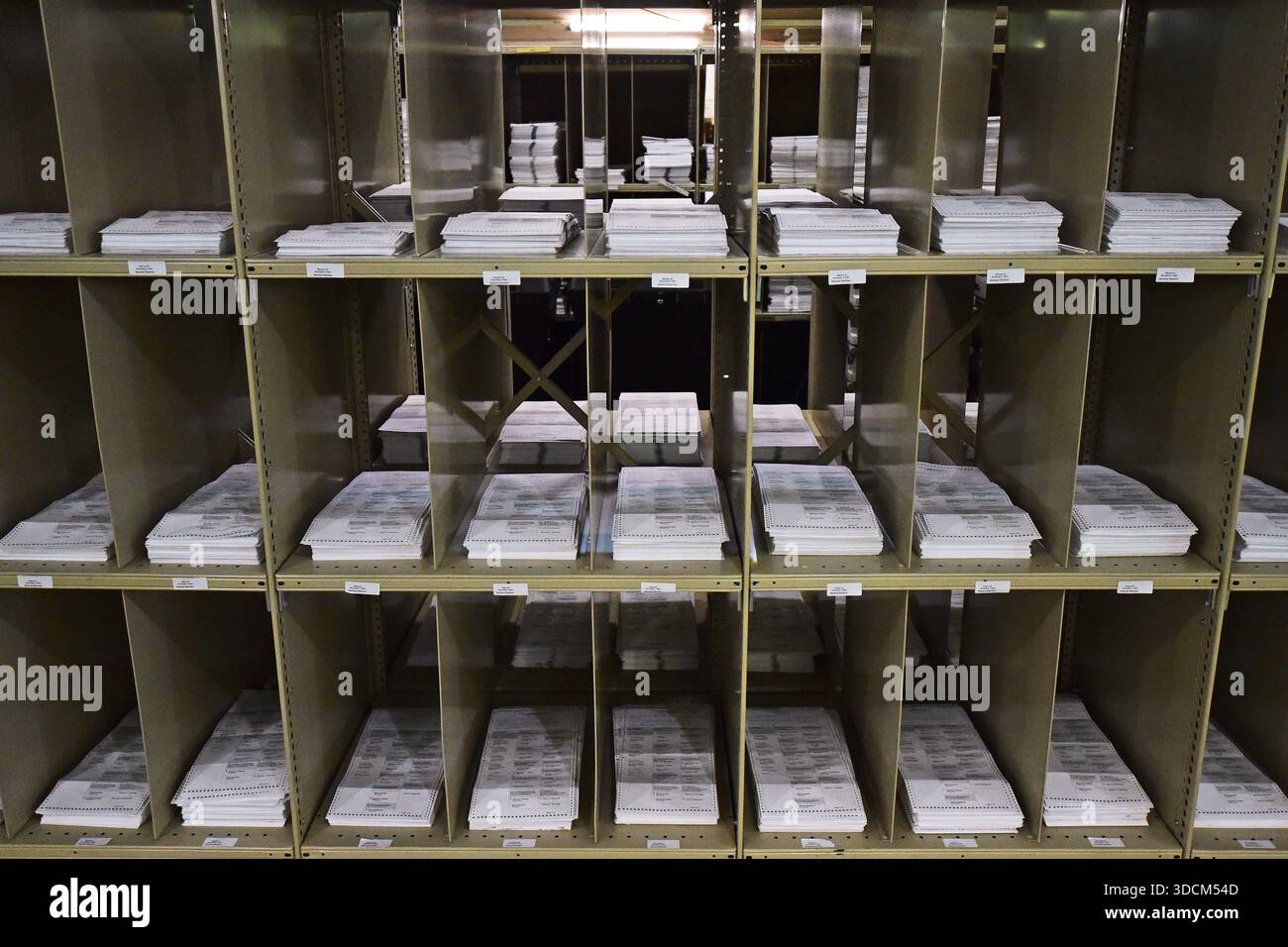 FILE - Mail-in ballots sit on shelves inside the Trumbull County Board ...