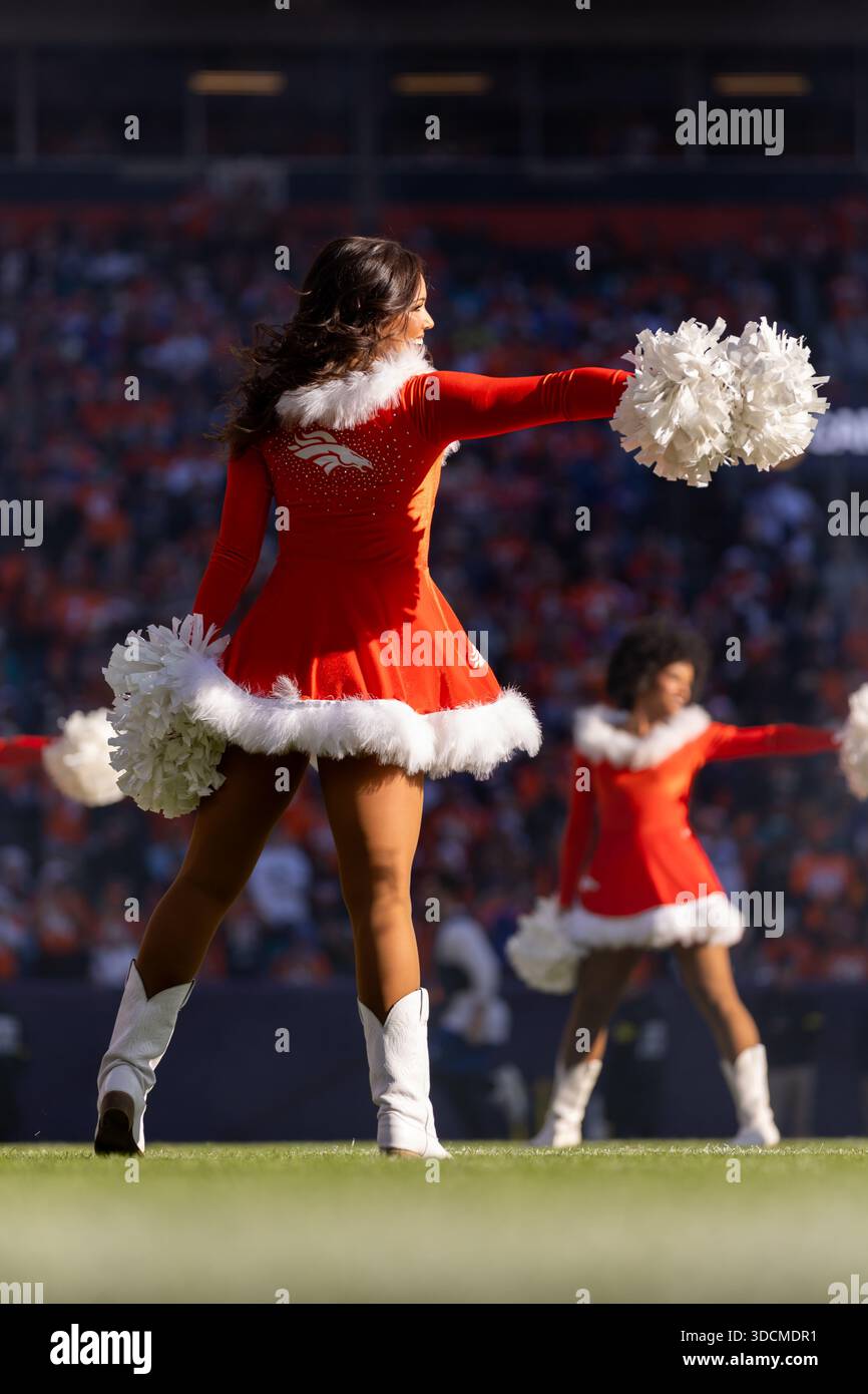 The Denver Broncos cheerleaders cheer in Christmas outfits before the ...